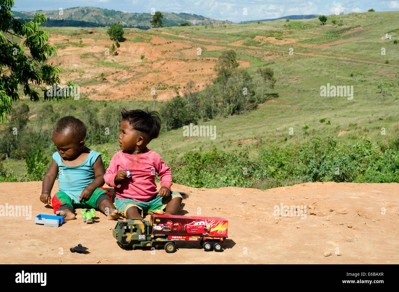 Madagascar, Antananarivo, children playing with toys in rural area ...
