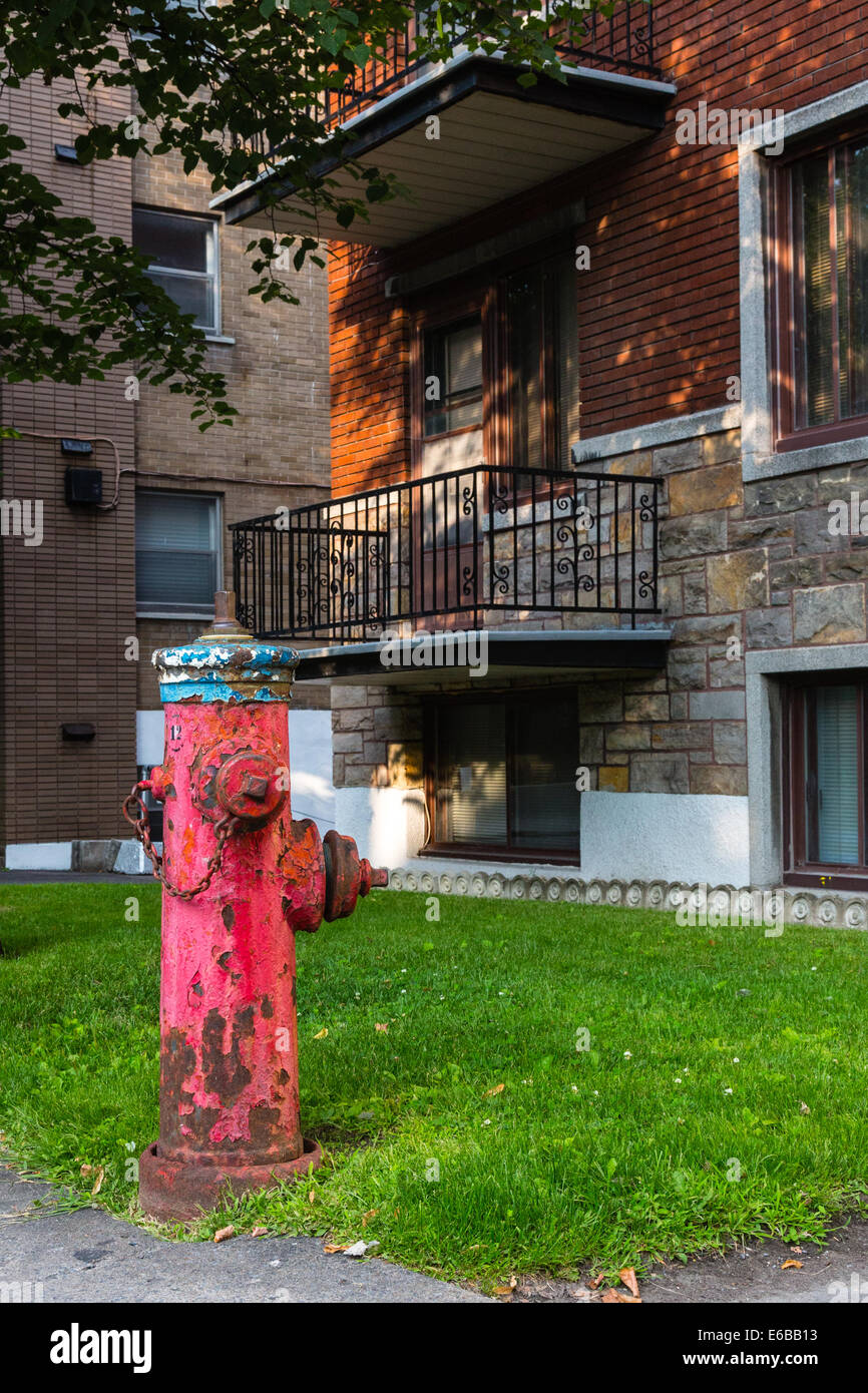 Old red fire hydrant in front of an apartment block Stock Photo - Alamy