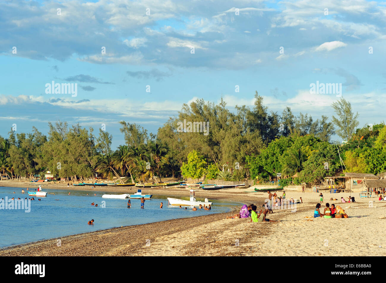 Madagascar, Tulear, Ifaty, families sitting on the beach Stock Photo ...