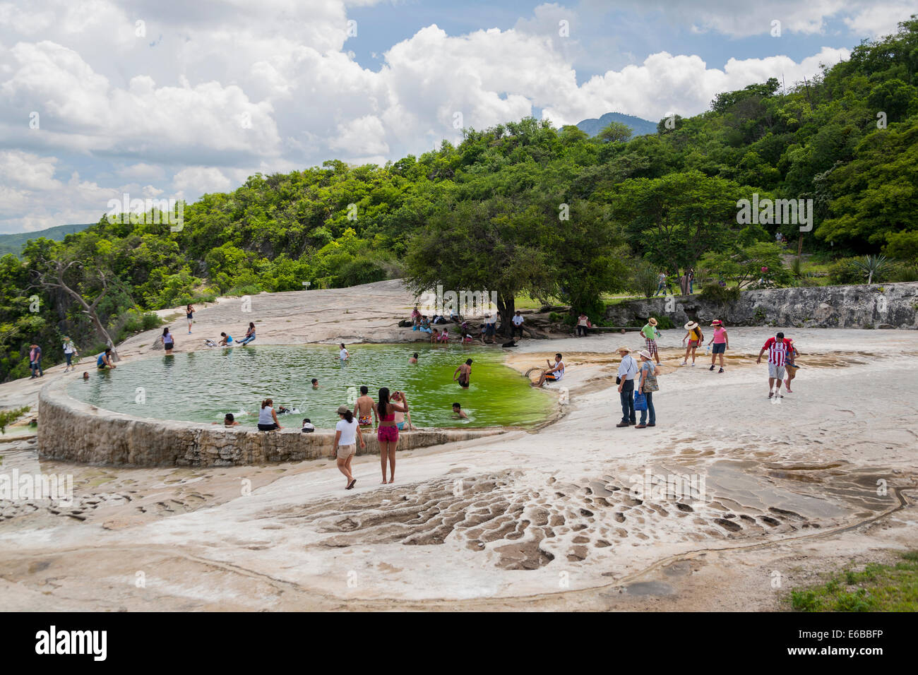 Mexico, Oaxaca. Hierve el Agua is a popular place to relax in the ...
