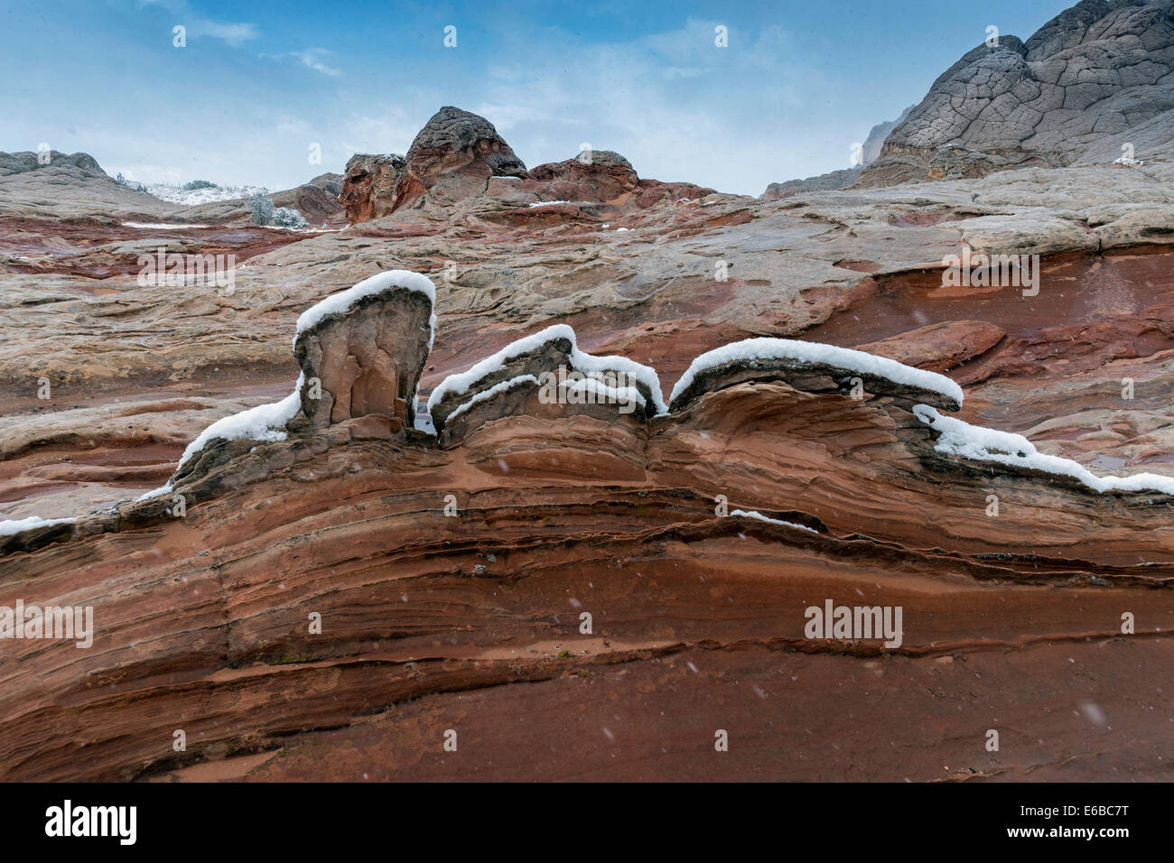April snow rimming sculptured rocks, White Pocket, Vermillion Cliffs ...