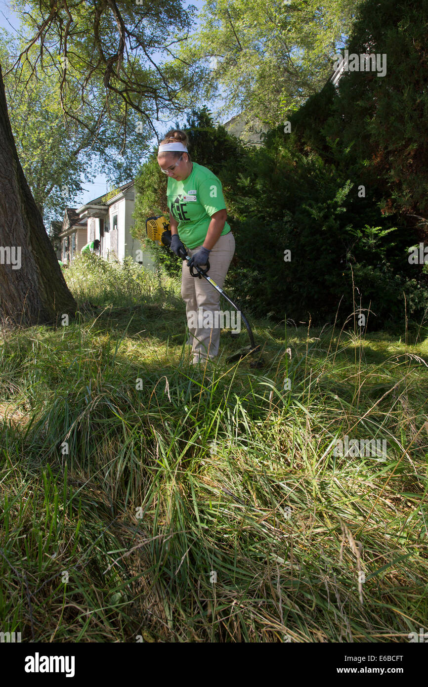 Detroit, Michigan - Volunteers clean up a distressed neighborhood ...