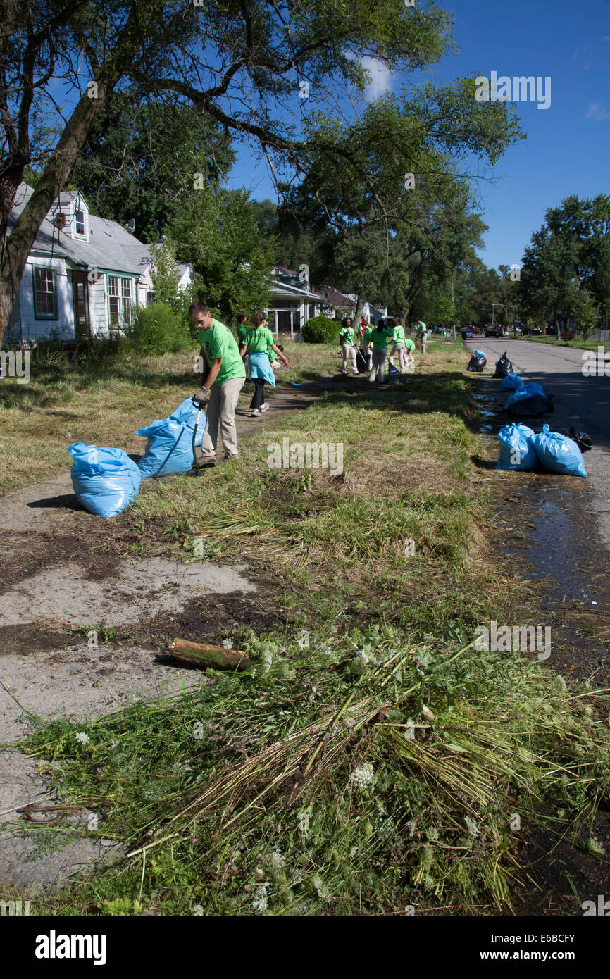 Detroit, Michigan - Volunteers clean up a distressed neighborhood ...