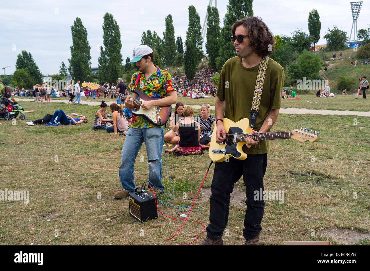 Musicians busking at weekend at Mauerpark in Prenzlauer Berg in Berlin ...