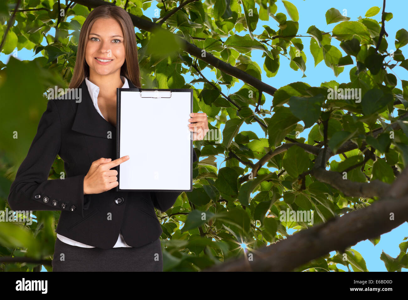 Businesswoman holding paper holder Stock Photo - Alamy