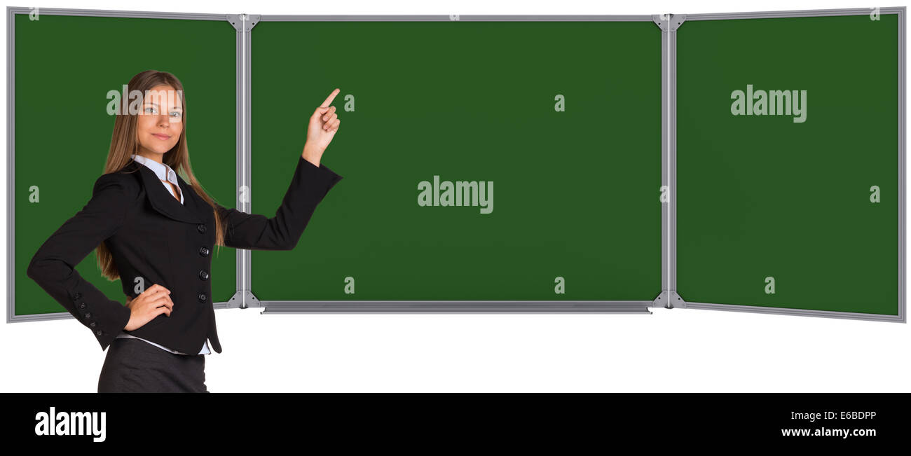 Businesswoman pointing her finger on chalkboard Stock Photo - Alamy