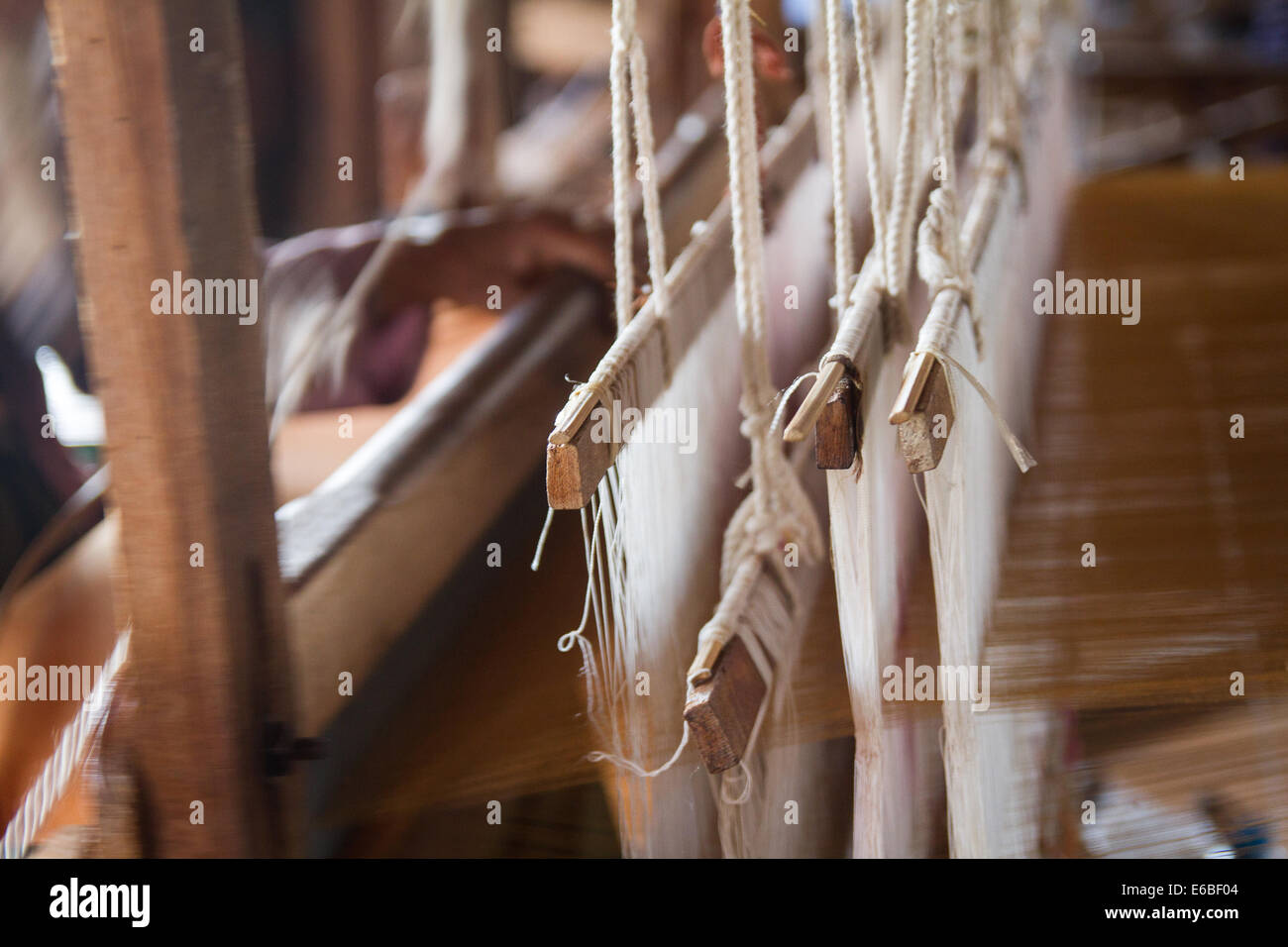 Closeup of weaving textiles on loom, Inle Lake, Shan State, Myanmar ...