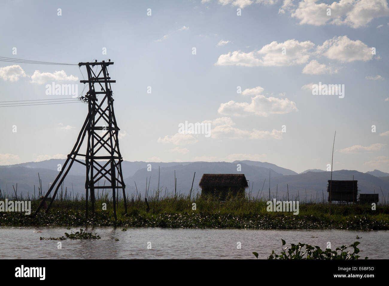 Houses and trestle tower supporting electric lines, Inle Lake, Shan ...