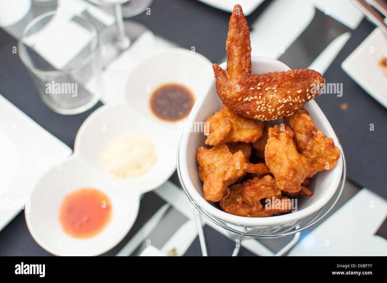 Chicken wings with three sauces Stock Photo - Alamy