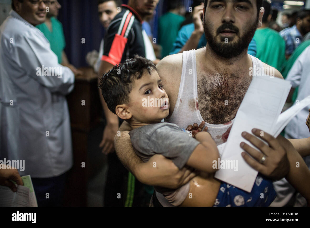 Gaza Strip, Gaza Strip. 19th Aug, 2014. A Palestinian man carries a ...