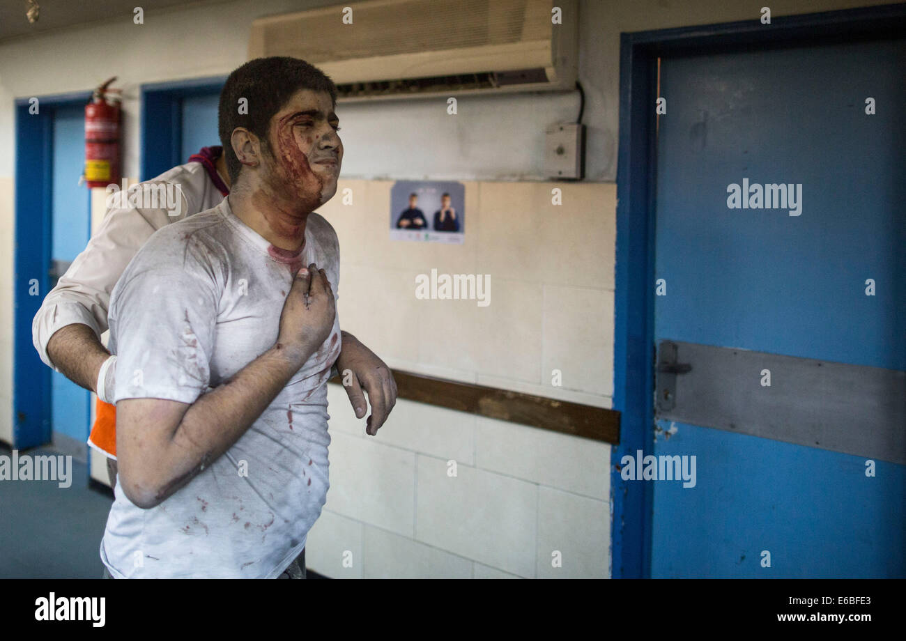 Gaza Strip, Gaza Strip. 19th Aug, 2014. A Palestinian man, who was ...