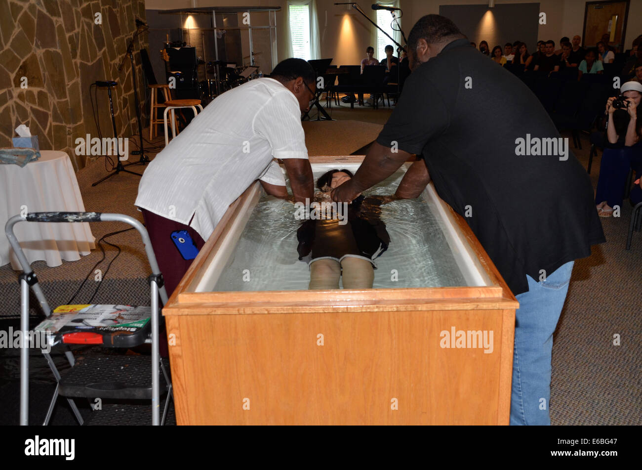 Young women gets baptized Stock Photo - Alamy