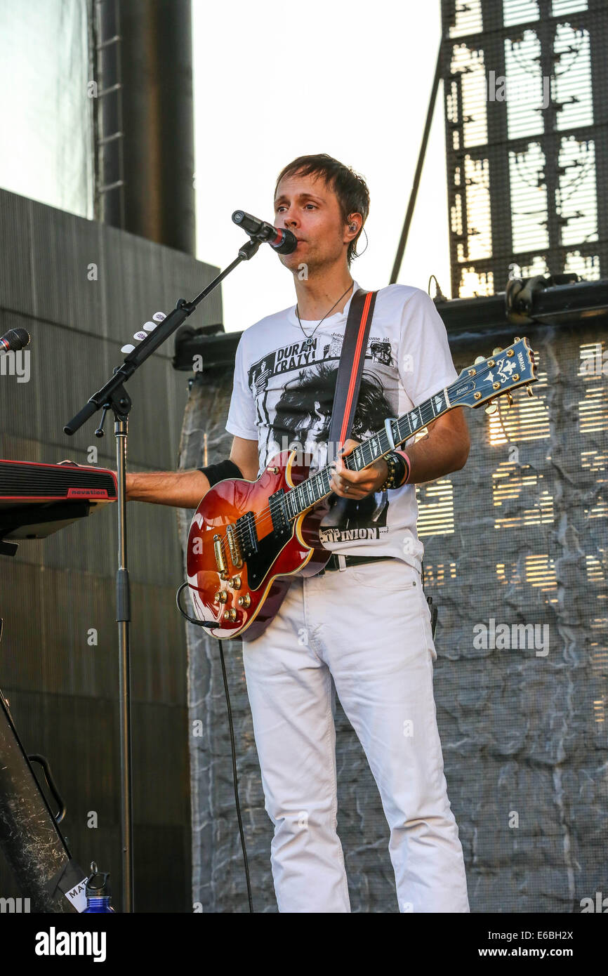 Red electric guitar played hi-res stock photography and images - Alamy