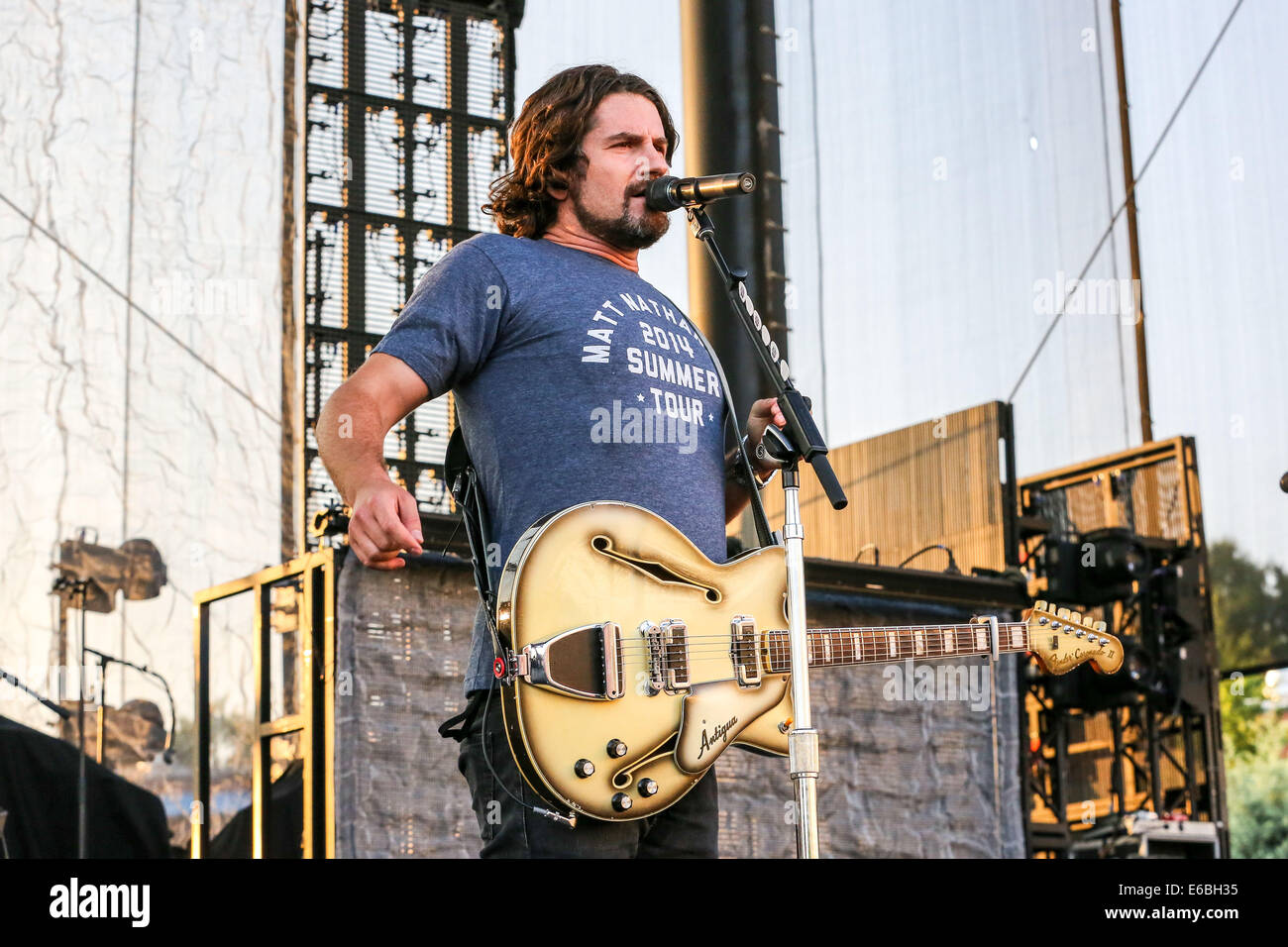 Red electric guitar played hi-res stock photography and images - Alamy