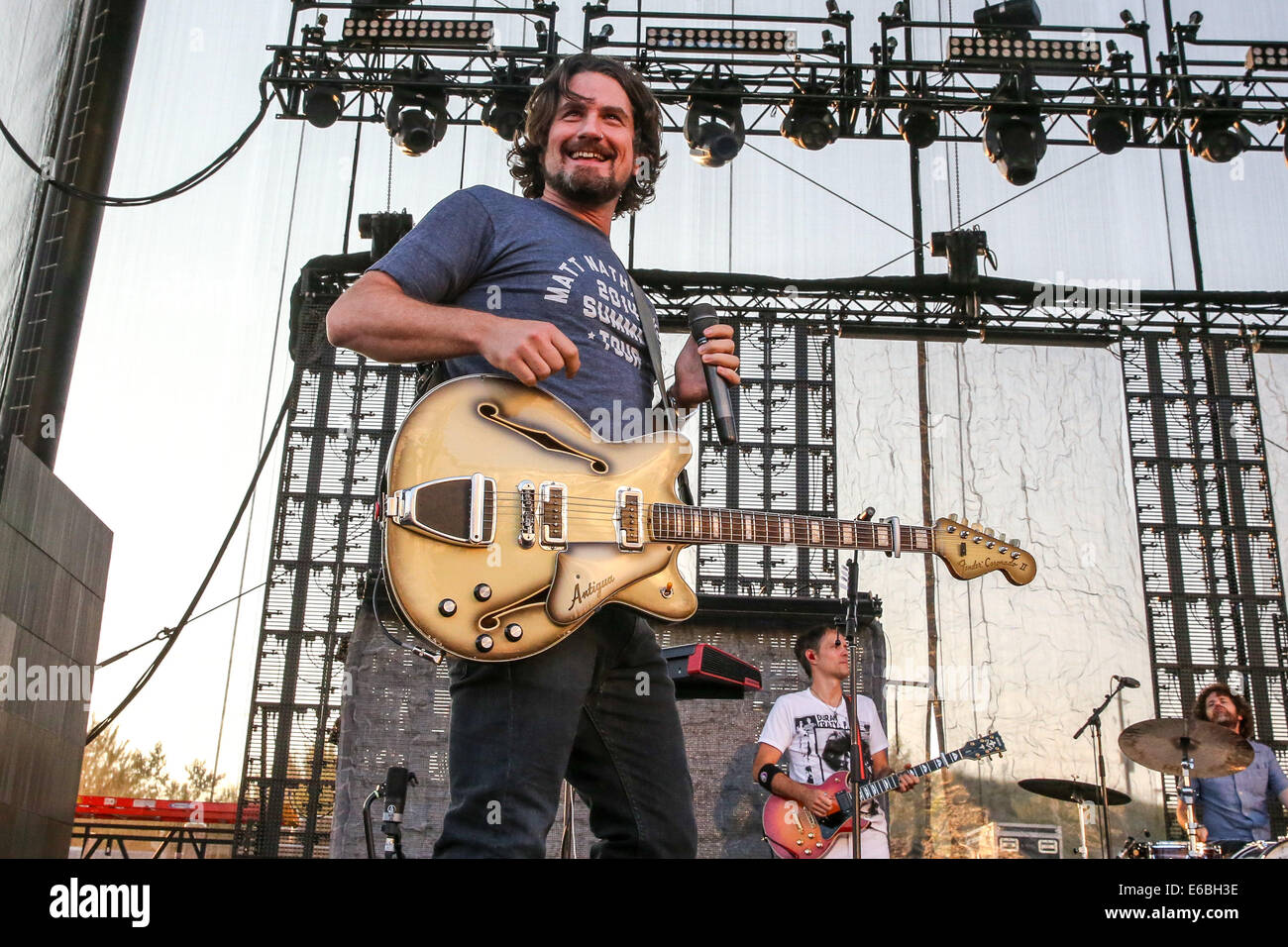 Red electric guitar played hi-res stock photography and images - Alamy