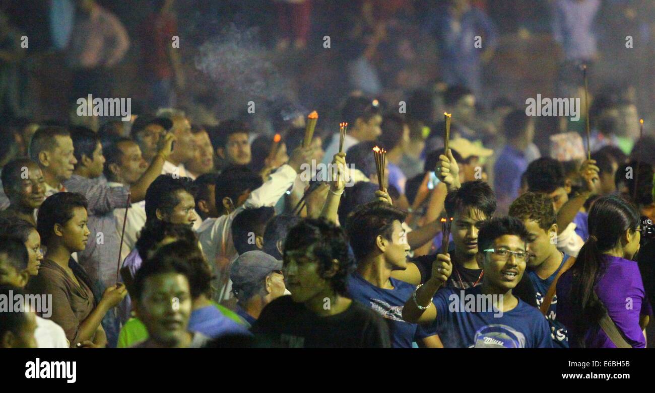 Lalitpur, Nepal. 19th Aug, 2014. Hindu devotees offer prayers to Lord ...
