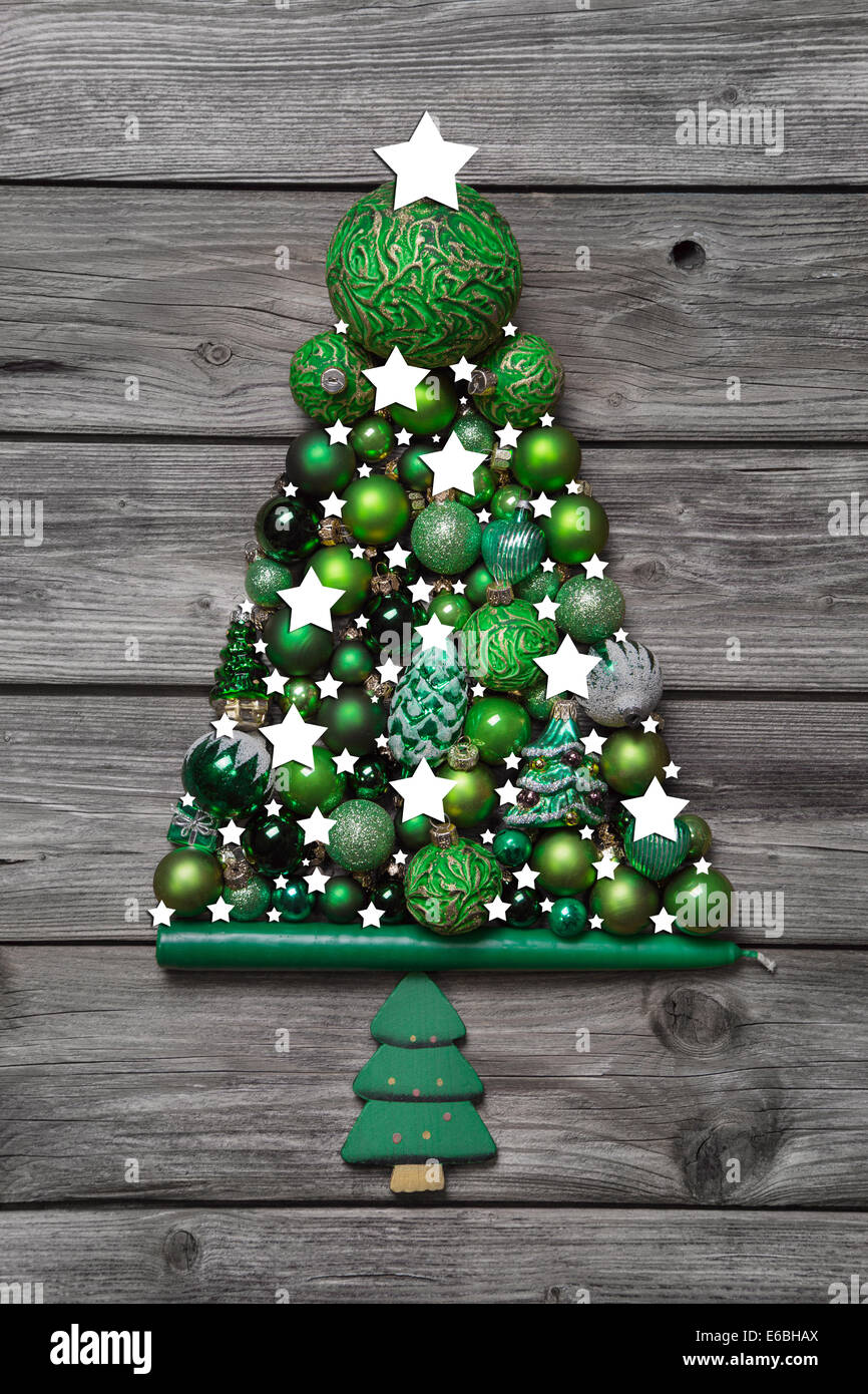 Green traditional christmas decoration with wood: tree of balls on grey ...