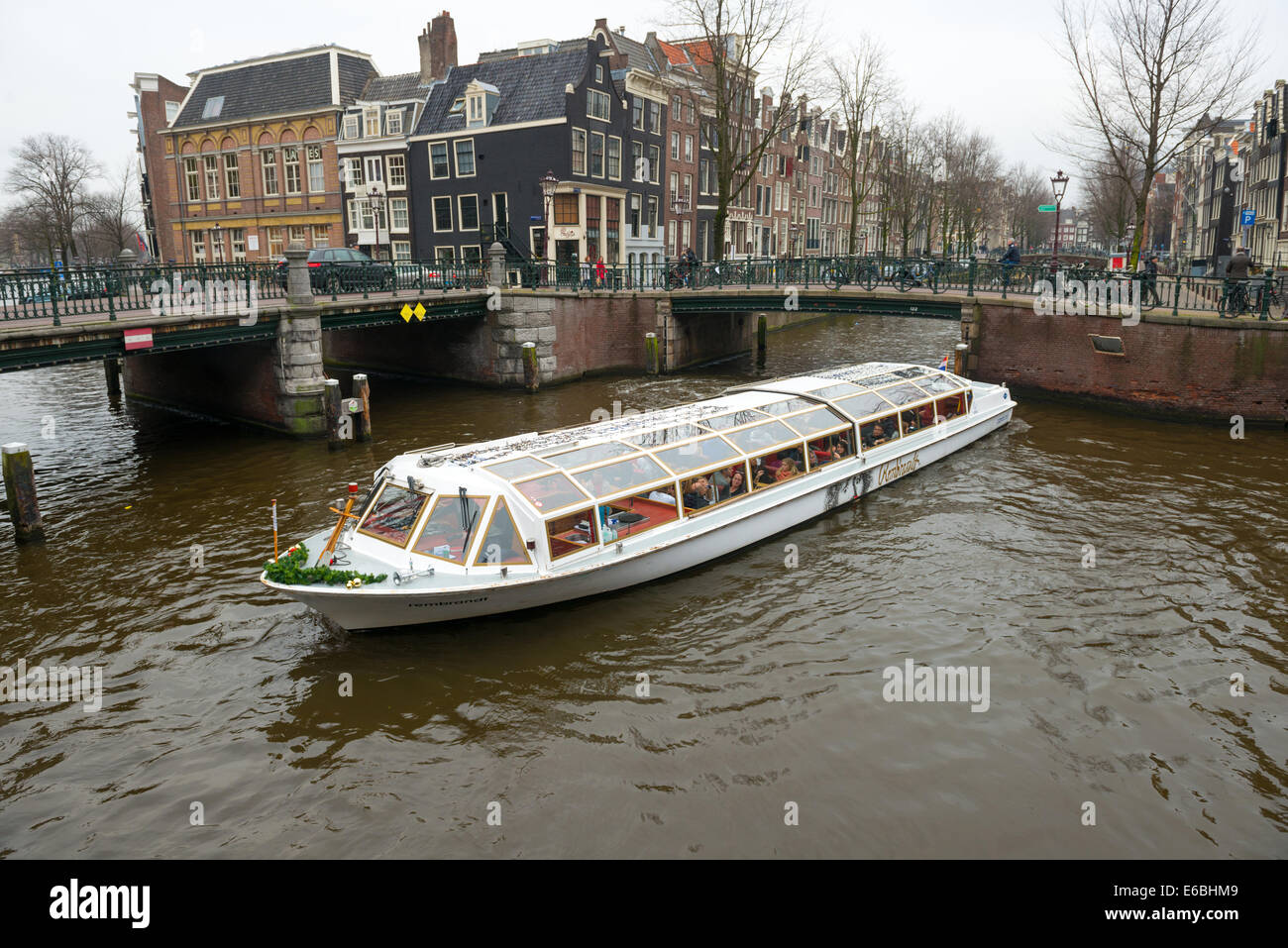 Passenger boats on canal tour in the city. Amsterdam Stock Photo - Alamy
