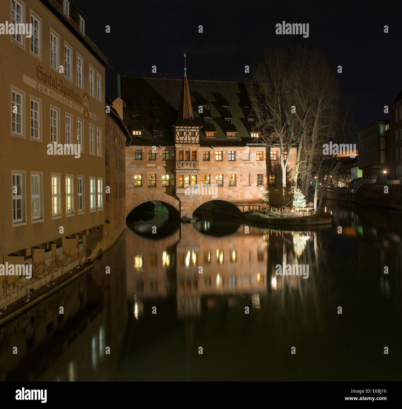Monastery Holy Spirit Hospice on the river bank and bridge at night in ...
