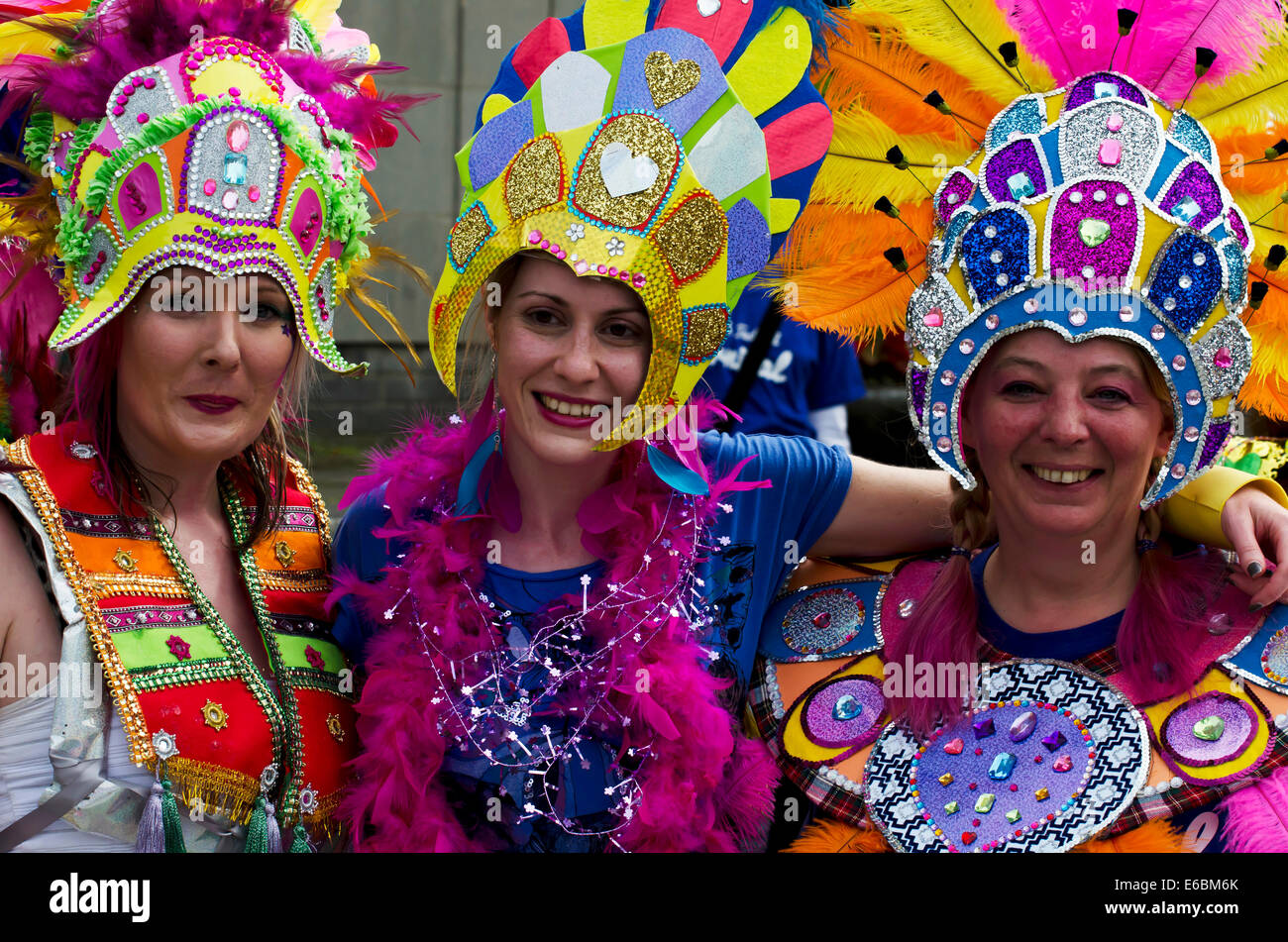 3 women in exotic costumes posing at the Carnival, part of Edinburgh's ...