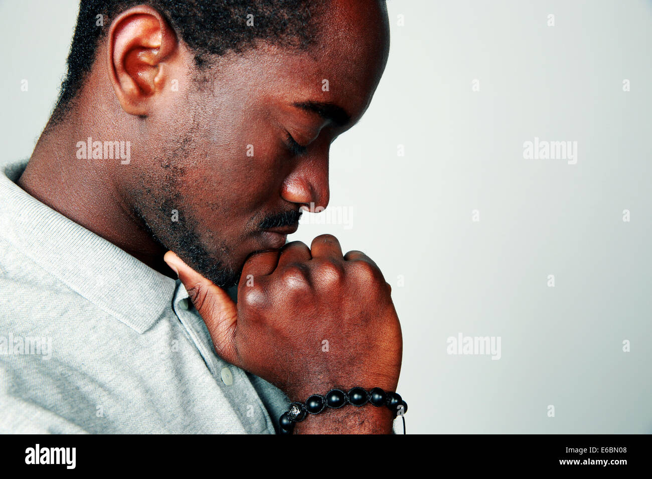 Side view portrait of a pensive african man on gray background Stock ...