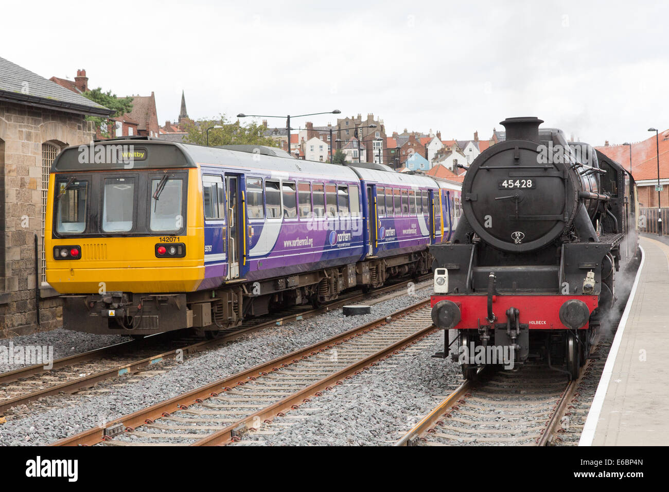 A passenger train arriving, at Whitby, from Middlesbrough. Alongside is ...