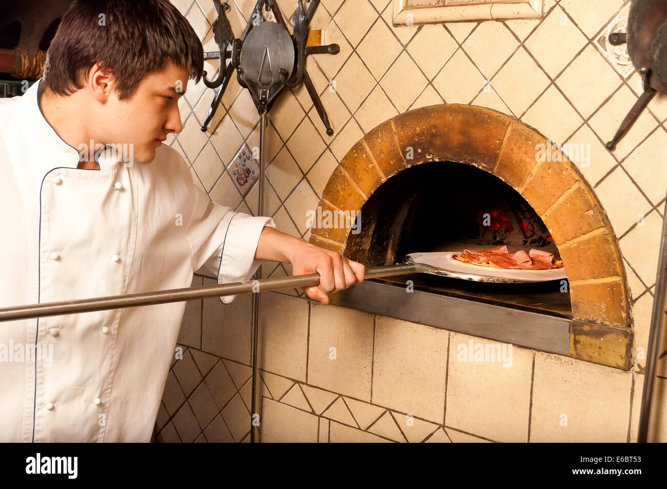 Hand preparing pizza crust sauce hi-res stock photography and images ...