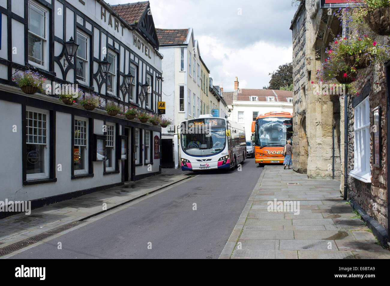 Buses passing in narrow UK street Stock Photo - Alamy