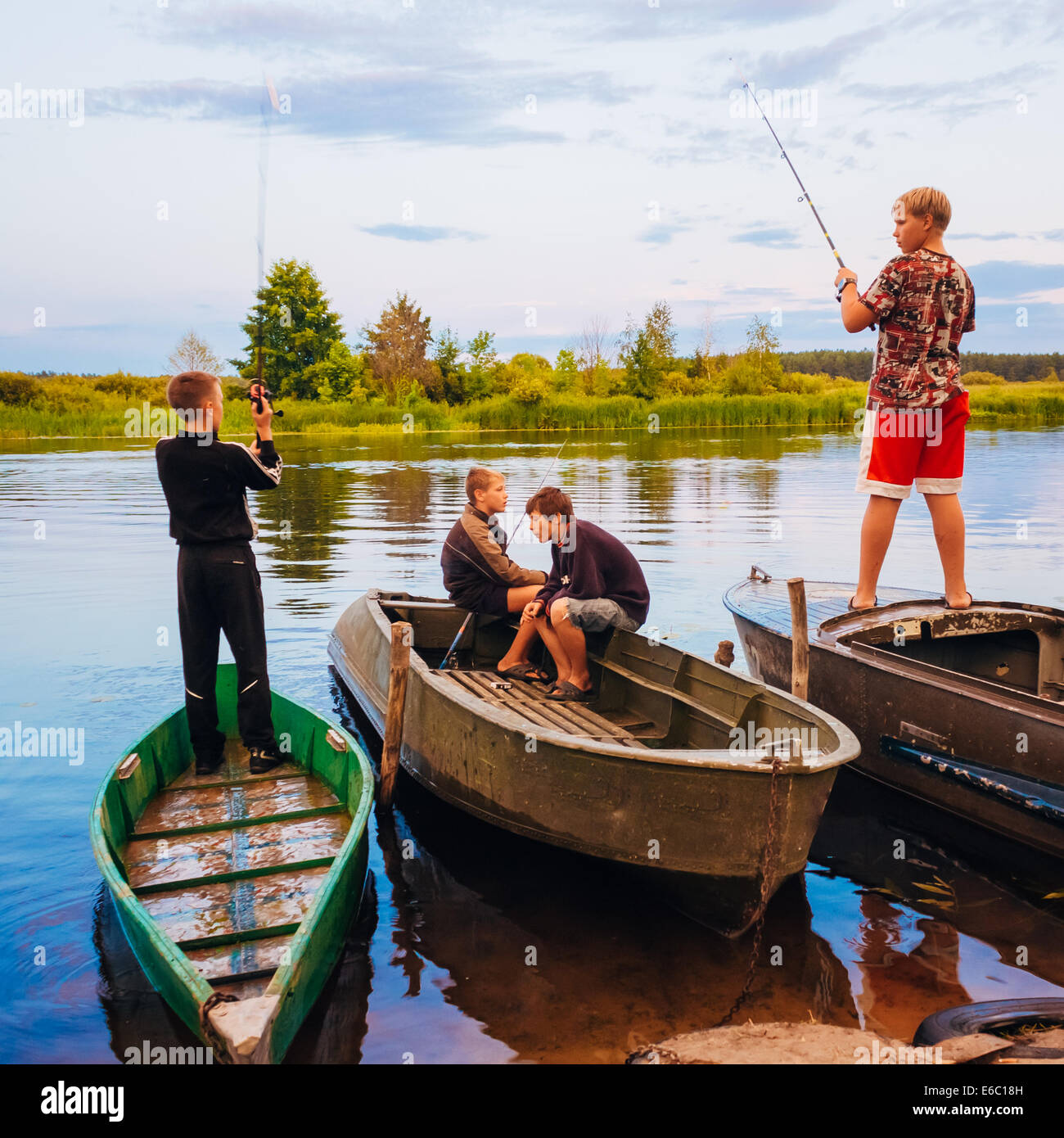 MINSK, BELARUS - JULY 25: Belarusian Children Fishing From Old Boats At ...