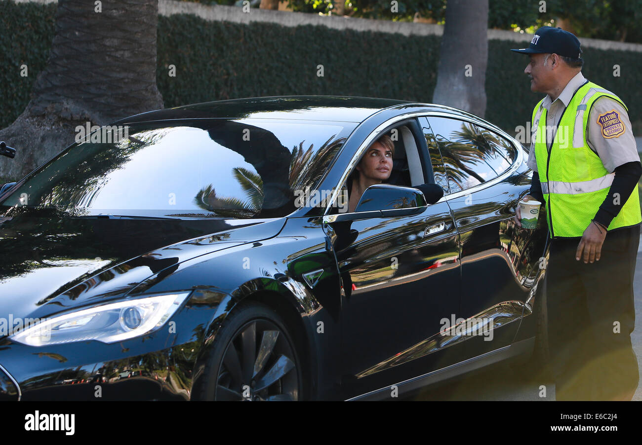 Lisa Rinna dressed all in black with skinny leather trousers and white ...