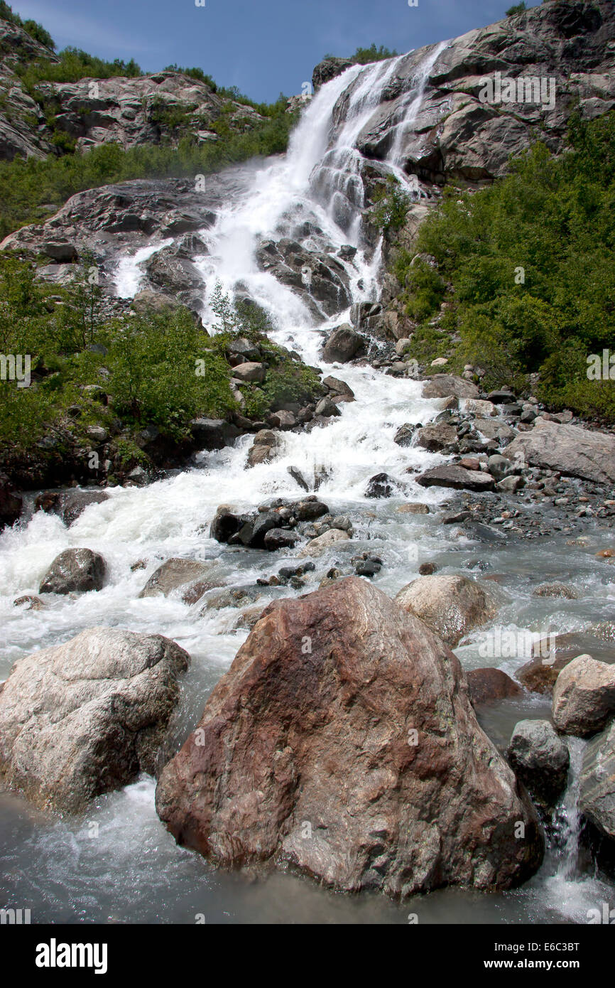 Alpine waterfall in mountain Stock Photo - Alamy
