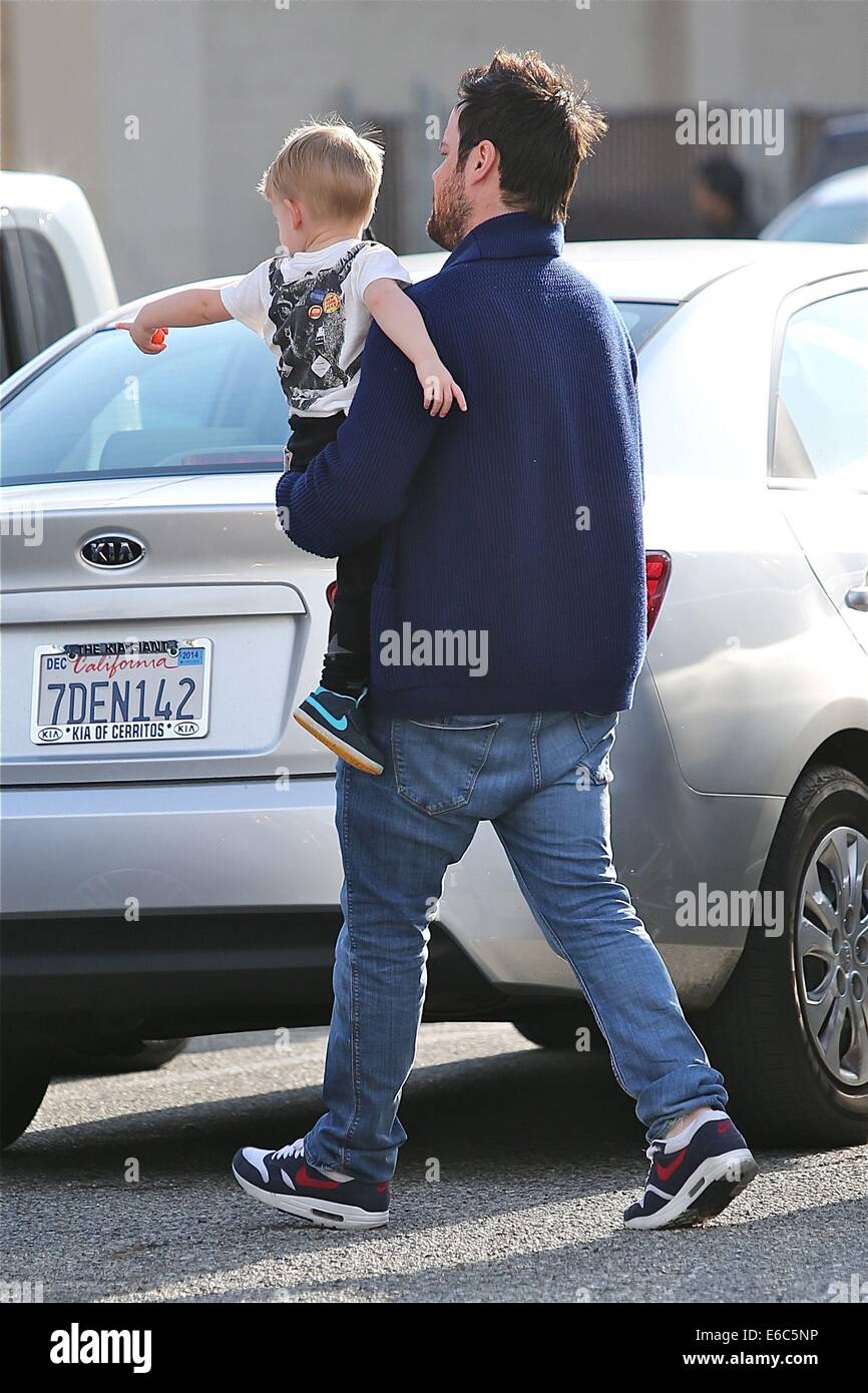 Mike Comrie carries son Luca in his arms as they spend some enjoy ...