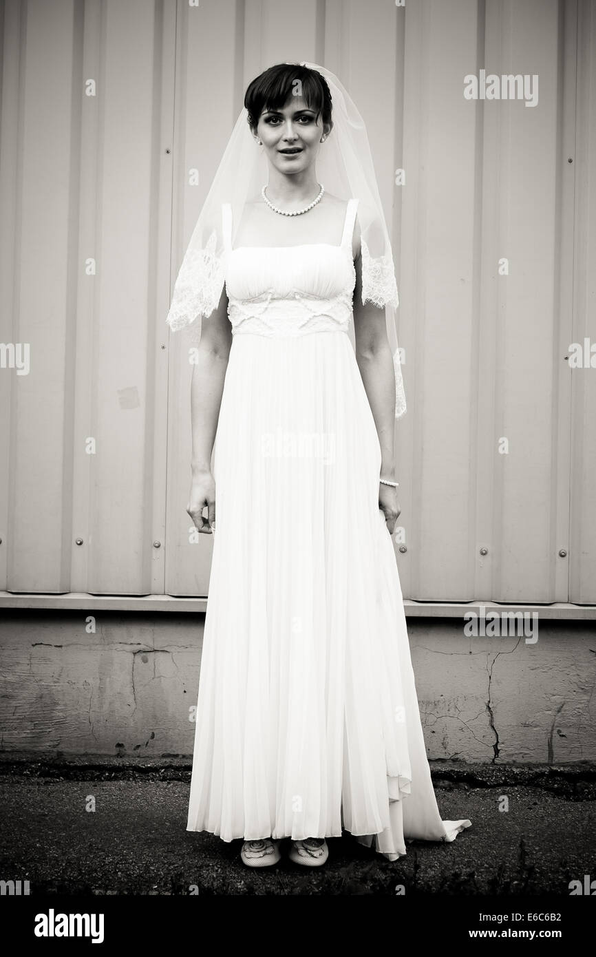 Full Length portrait of beautiful bride standing against wall Stock ...
