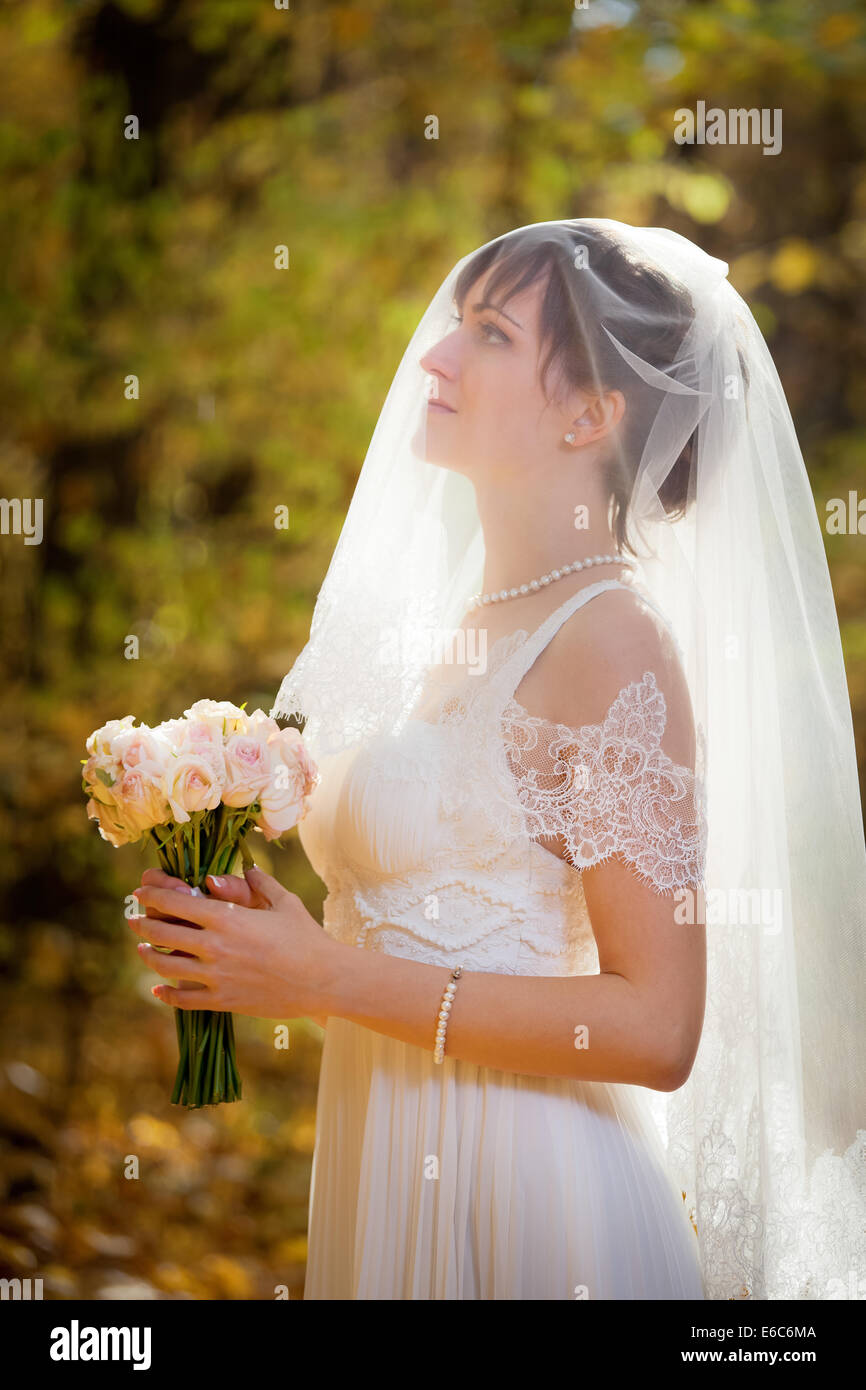 Bride in park profile hi-res stock photography and images - Alamy