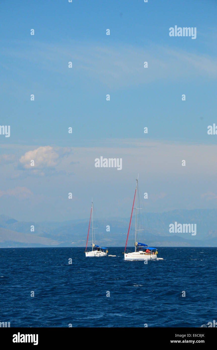 Two boats in a row sailing Stock Photo - Alamy