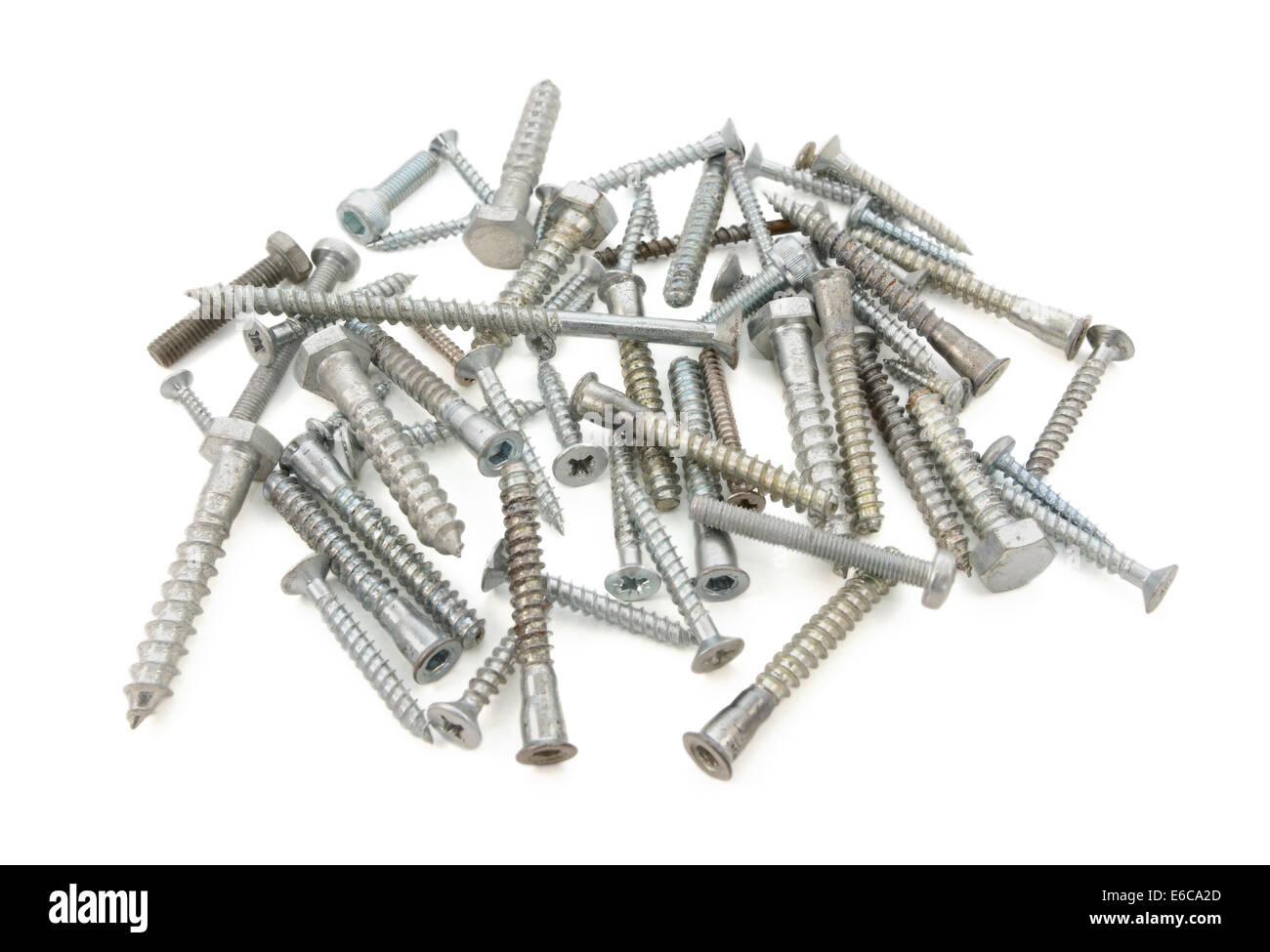 Mixed pile of screws and bolts of different sizes and kinds, isolated ...