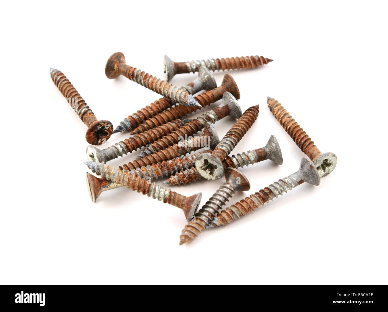 Pile of rusty Phillips head wood screws, isolated on a white background ...