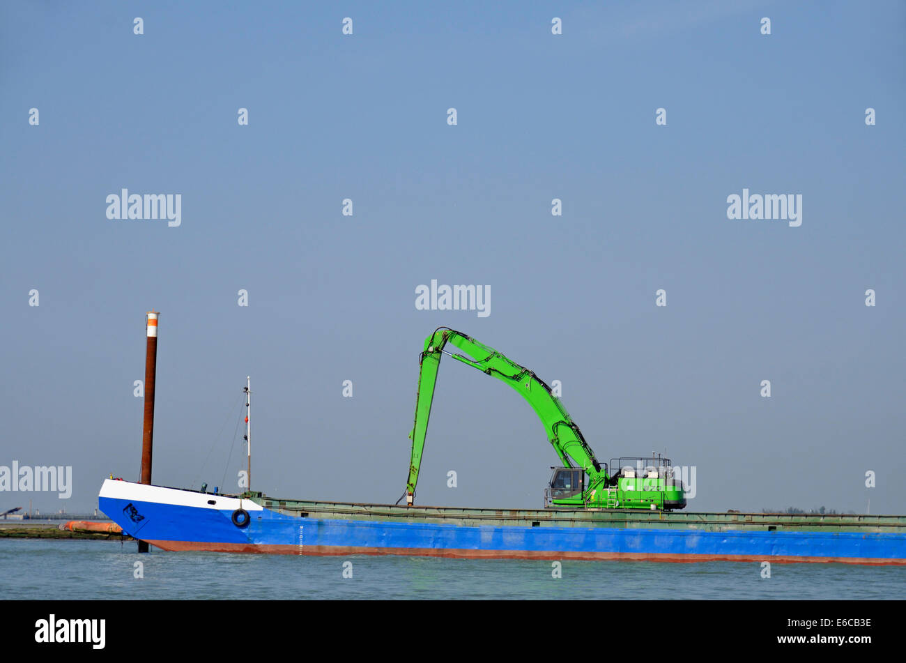 Dredging vehicle or dredger on a barge on the Venetian lagoon, Venice ...