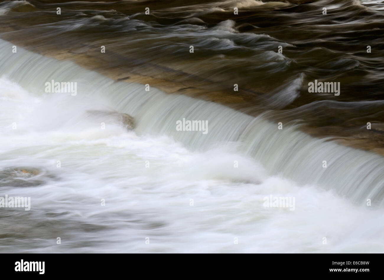 River flowing over a weir Stock Photo - Alamy