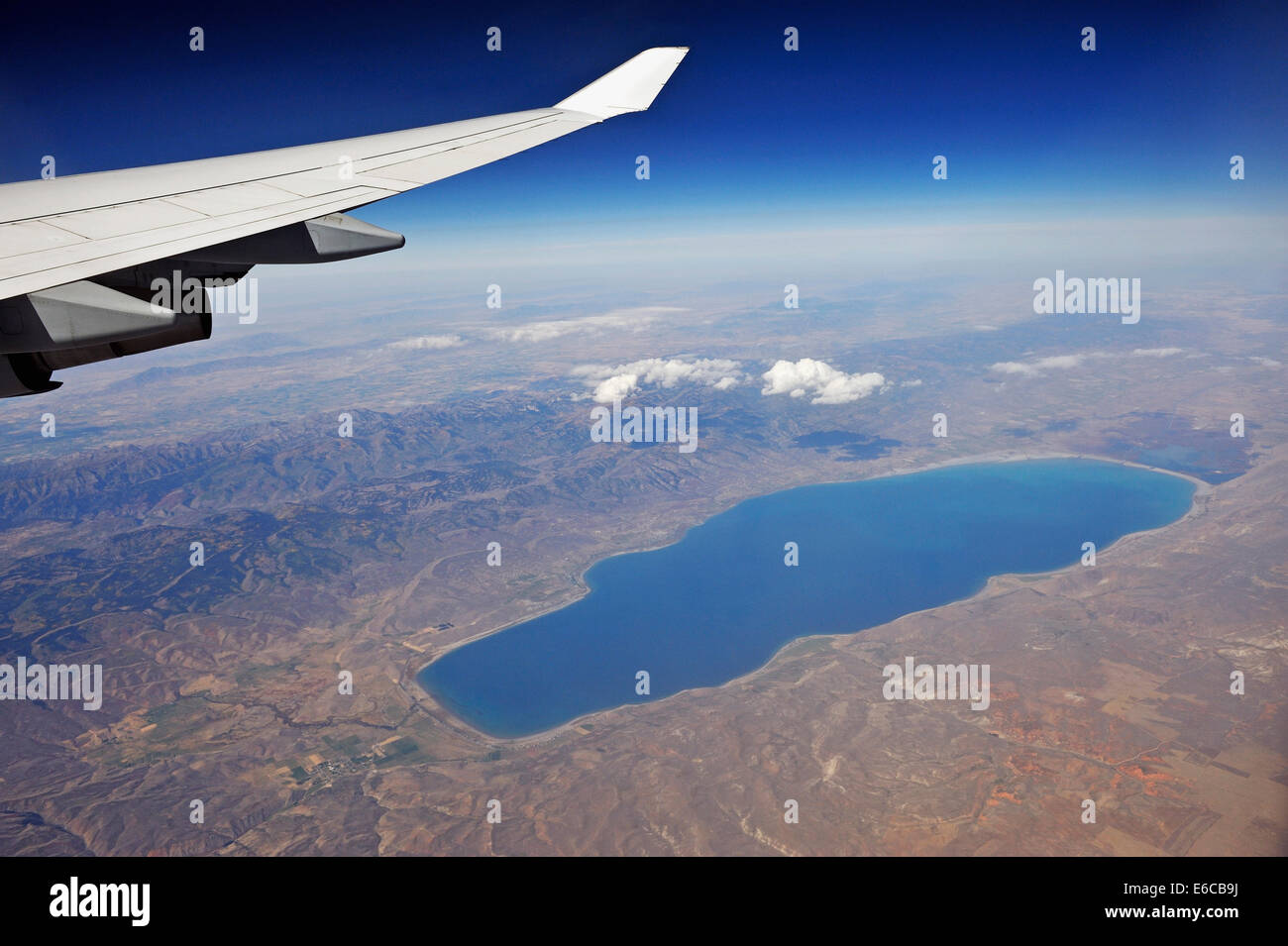 Wing of flying airplane over lake and mountains near Salt Lake City ...