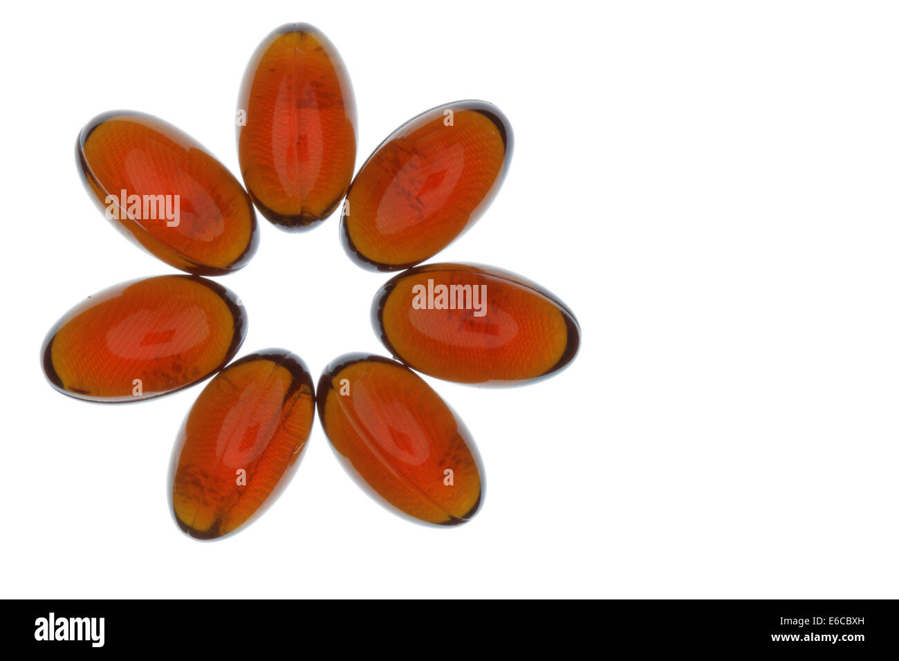 Flower made from red capsules isolated over white background Stock ...
