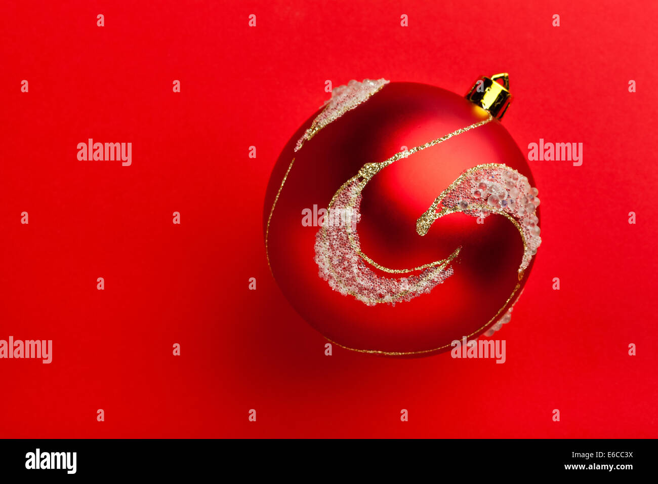 This is a closeup of red ball on red background. Free space for your ...