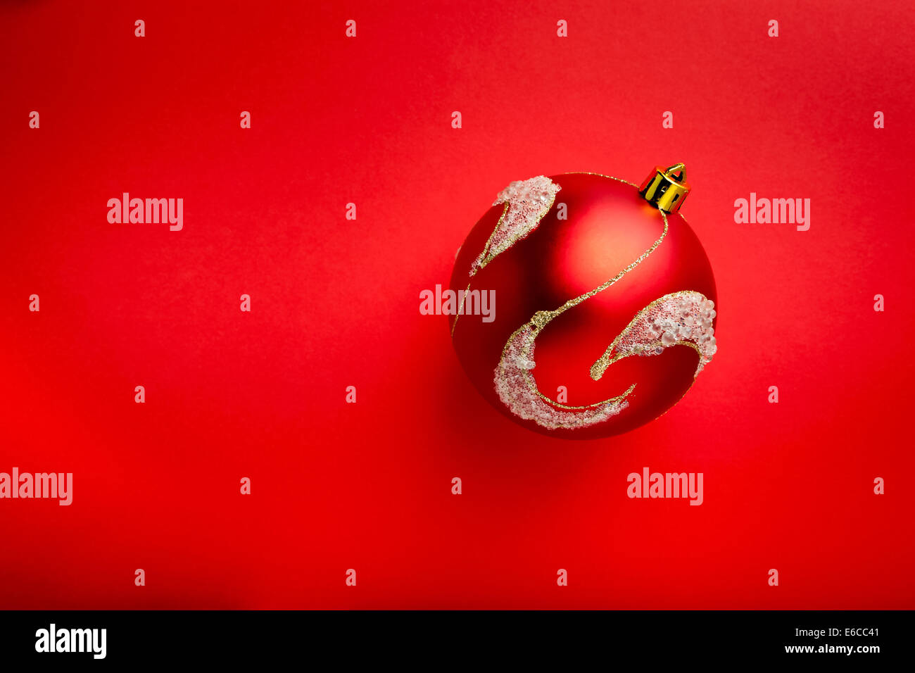 This is a closeup of red ball on red background. Free space for your ...