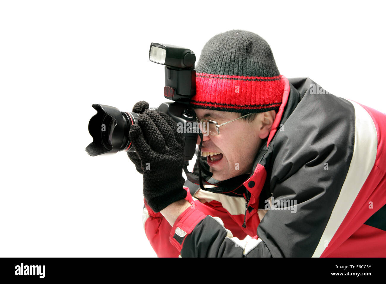 Professional photographer taking a shot isolated over white background ...