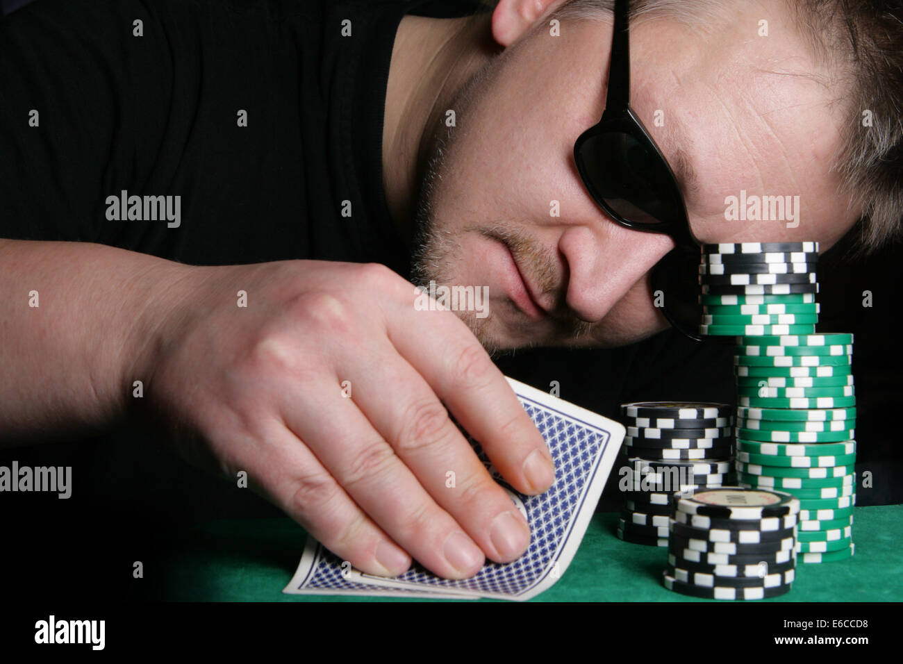 Poker gambler and casino chips close-up Stock Photo - Alamy
