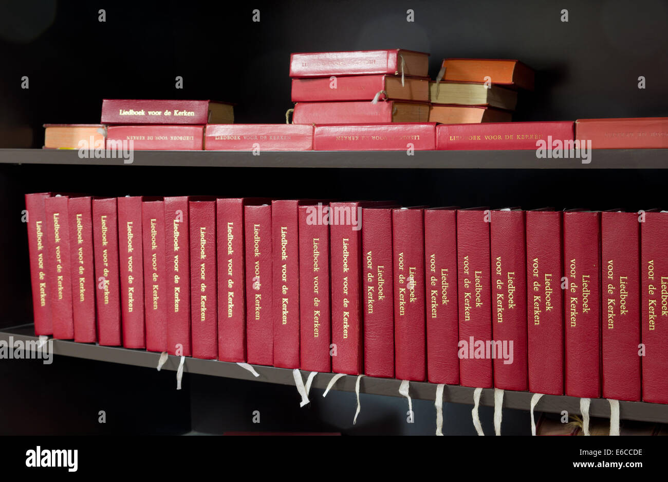 row of red church song books Stock Photo - Alamy