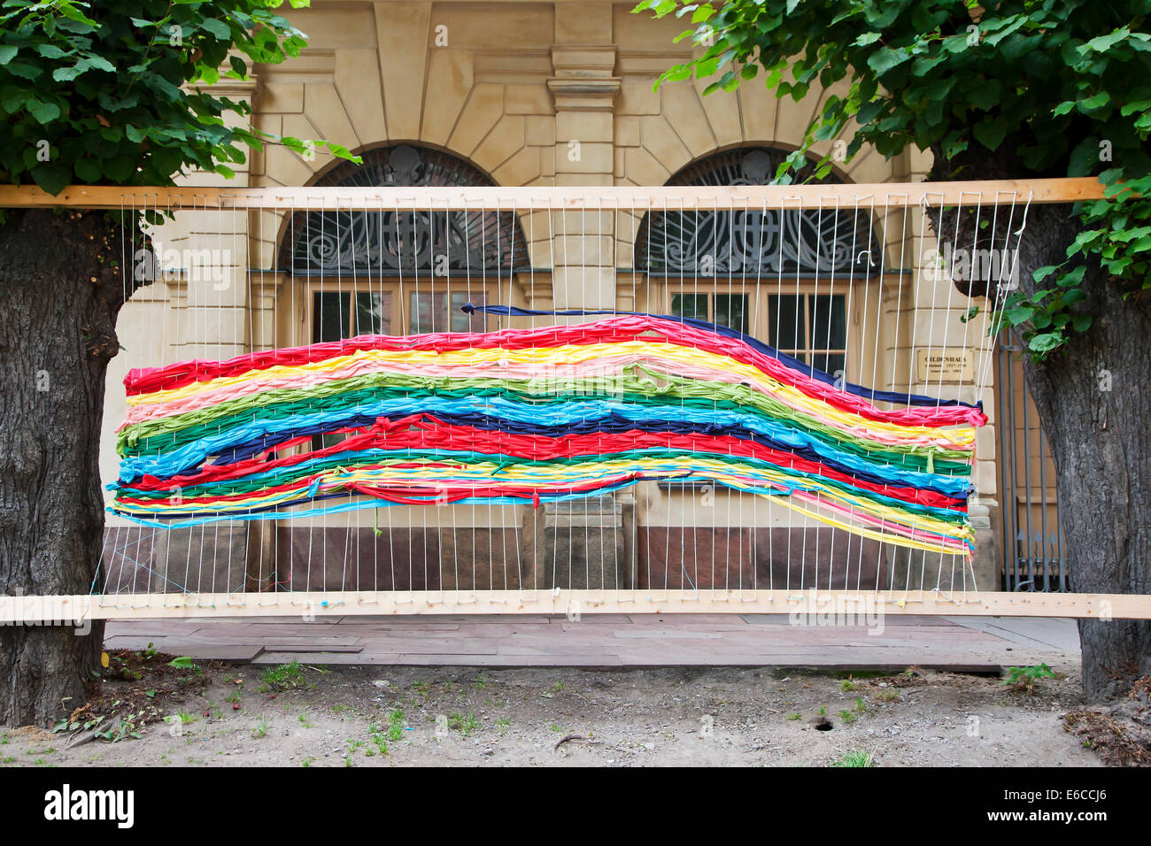 Weaving a carpet between two trees Stock Photo - Alamy