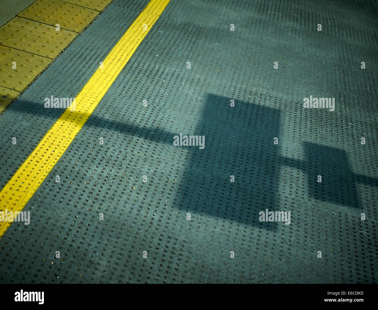 Shadow play on railway station platform UK Stock Photo - Alamy