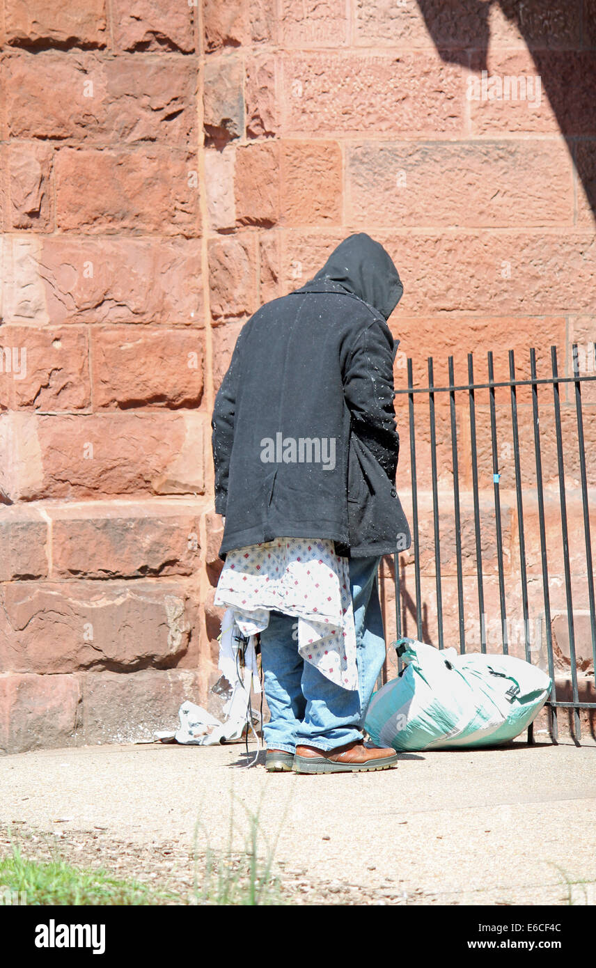 Beggar outside a church hi-res stock photography and images - Alamy