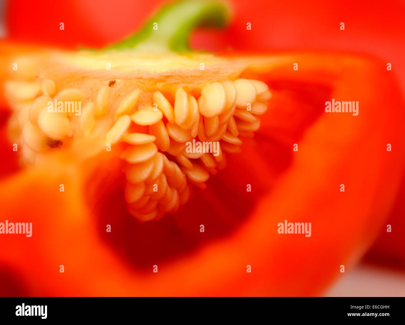 A red bell pepper cut in half showing close up detail of seeds Stock ...